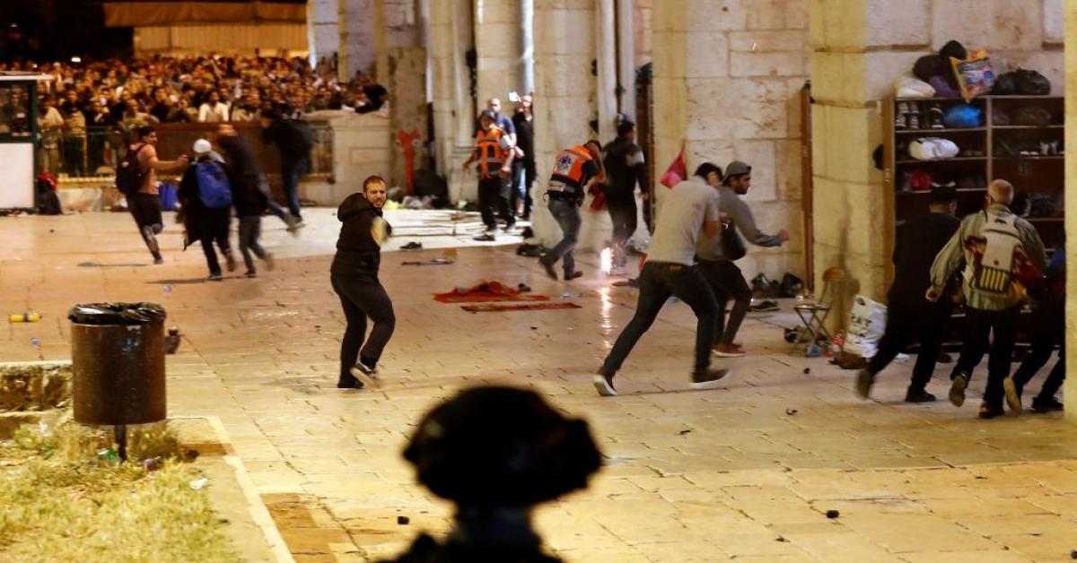 Dozens injured, hospitalized in clash between police, worshippers at ...